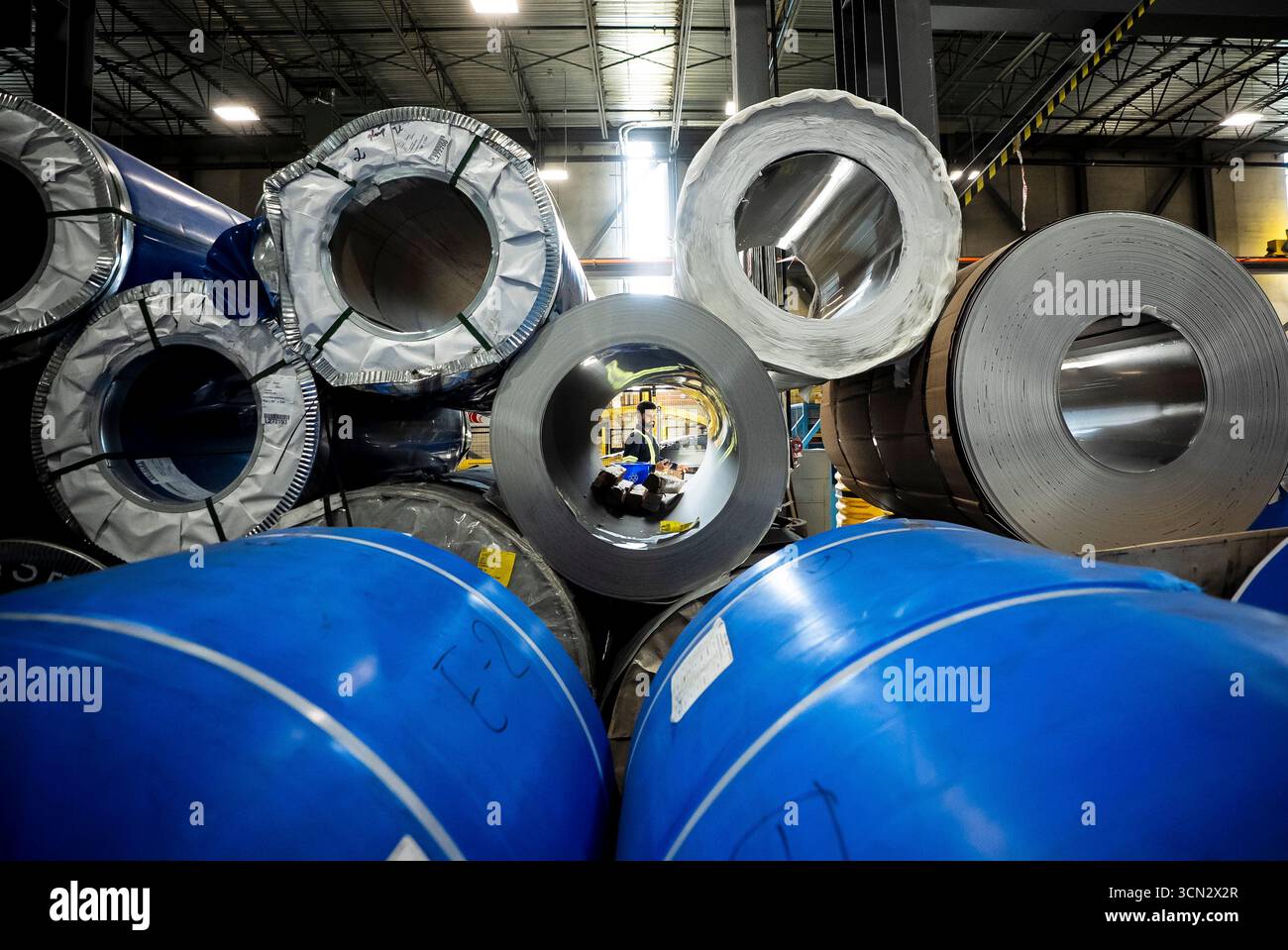 Stainless steel coils wait to be pressed into sheets at Magna Stainless ...