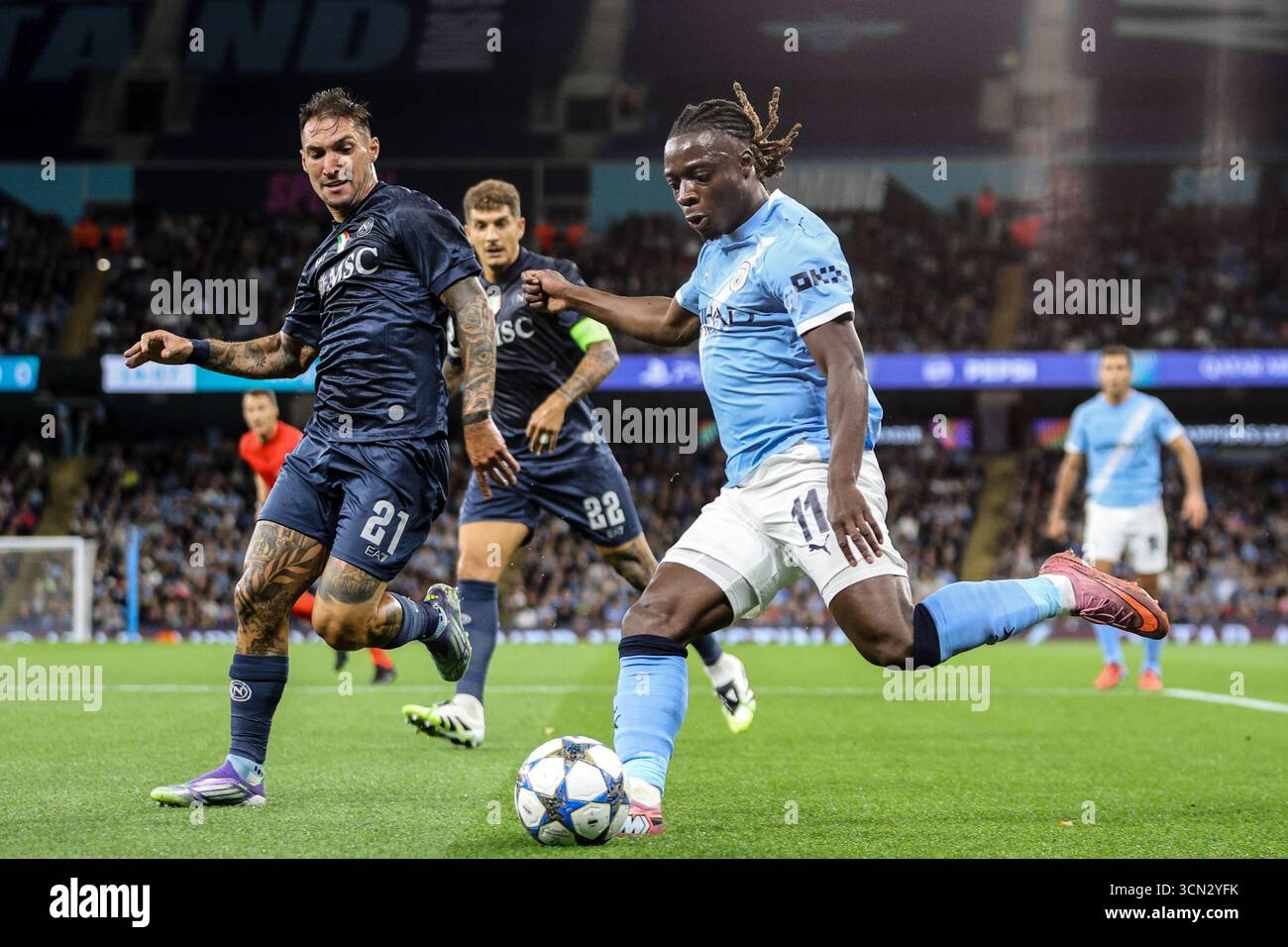 Jeremy Doku (11 Man City) crosses the ball during the UEFA Champions ...