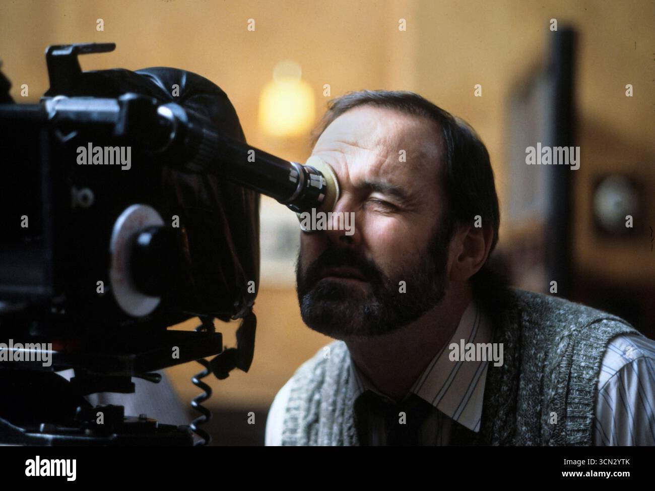John Cleese, looking through television studion camera. He is starring ...
