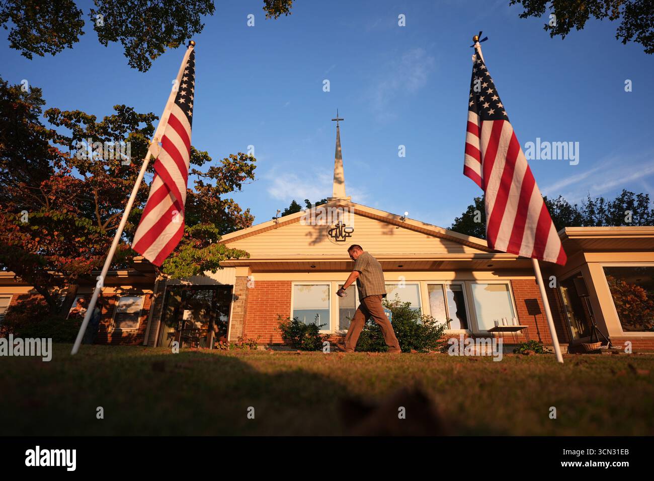 An attendee walks outside Spring Grove Alliance church before a vigil ...