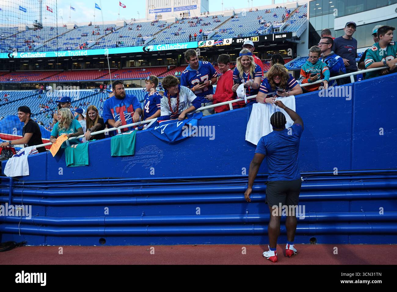 Buffalo Bills fullback Reggie Gilliam, right, greets a fan before an ...