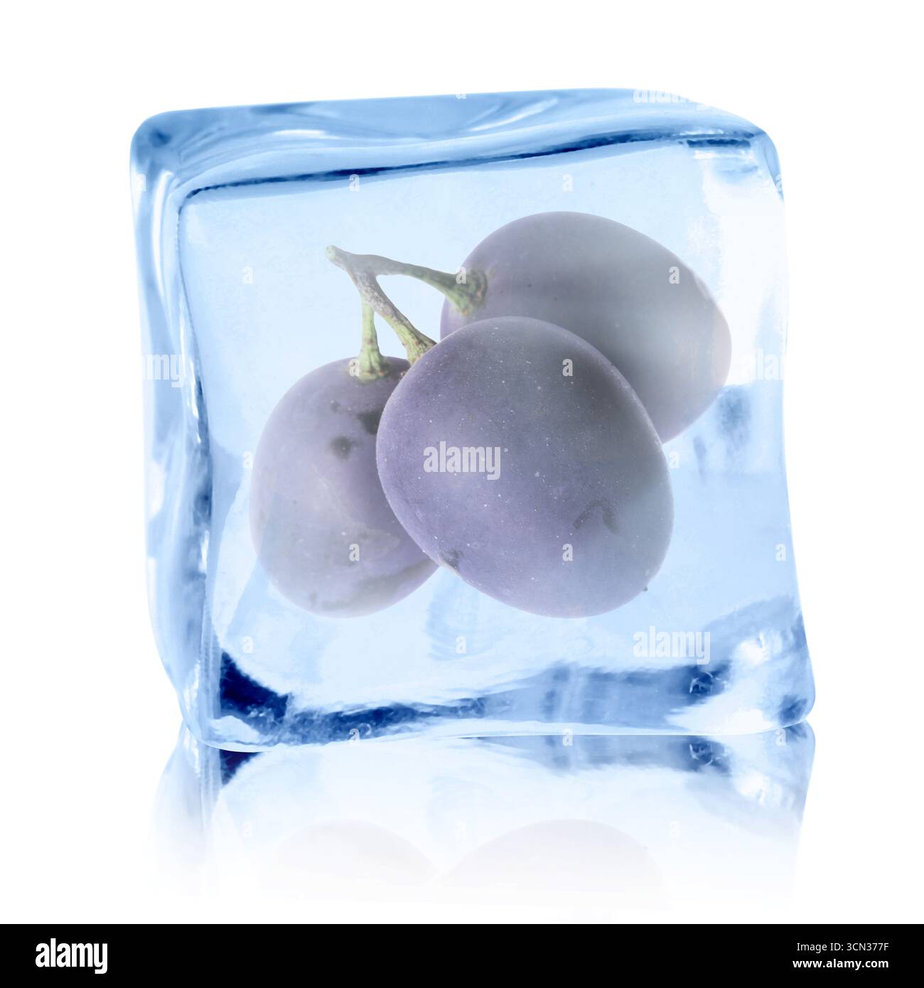 Fresh grapes inside ice cube on white background Stock Photo - Alamy