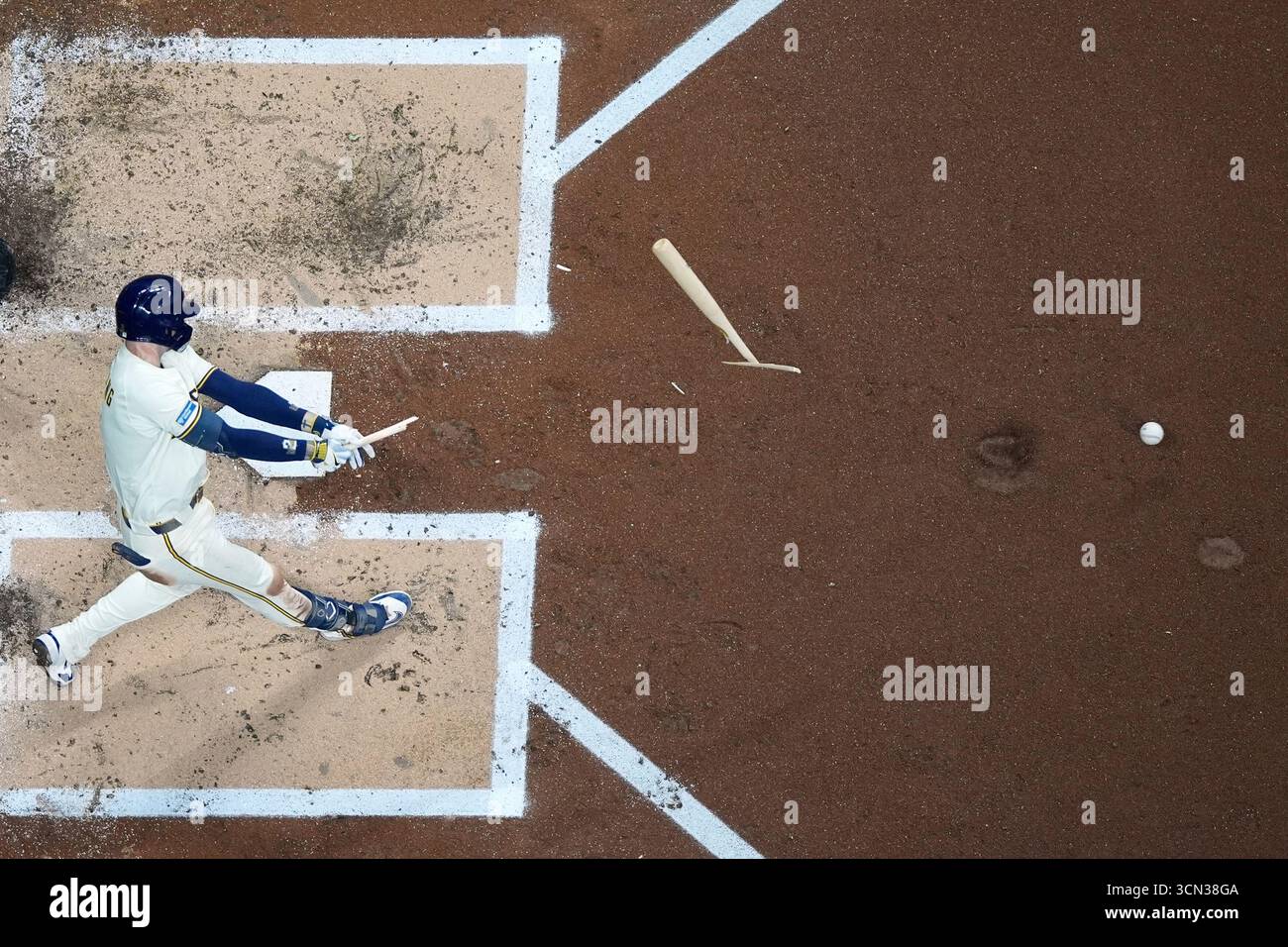 Milwaukee Brewers' Brice Turang hits a broken-bat single during the ...