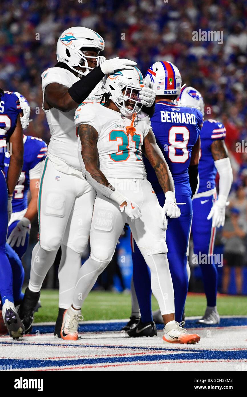 Miami Dolphins running back Ollie Gordon II (31) is congratulated by ...