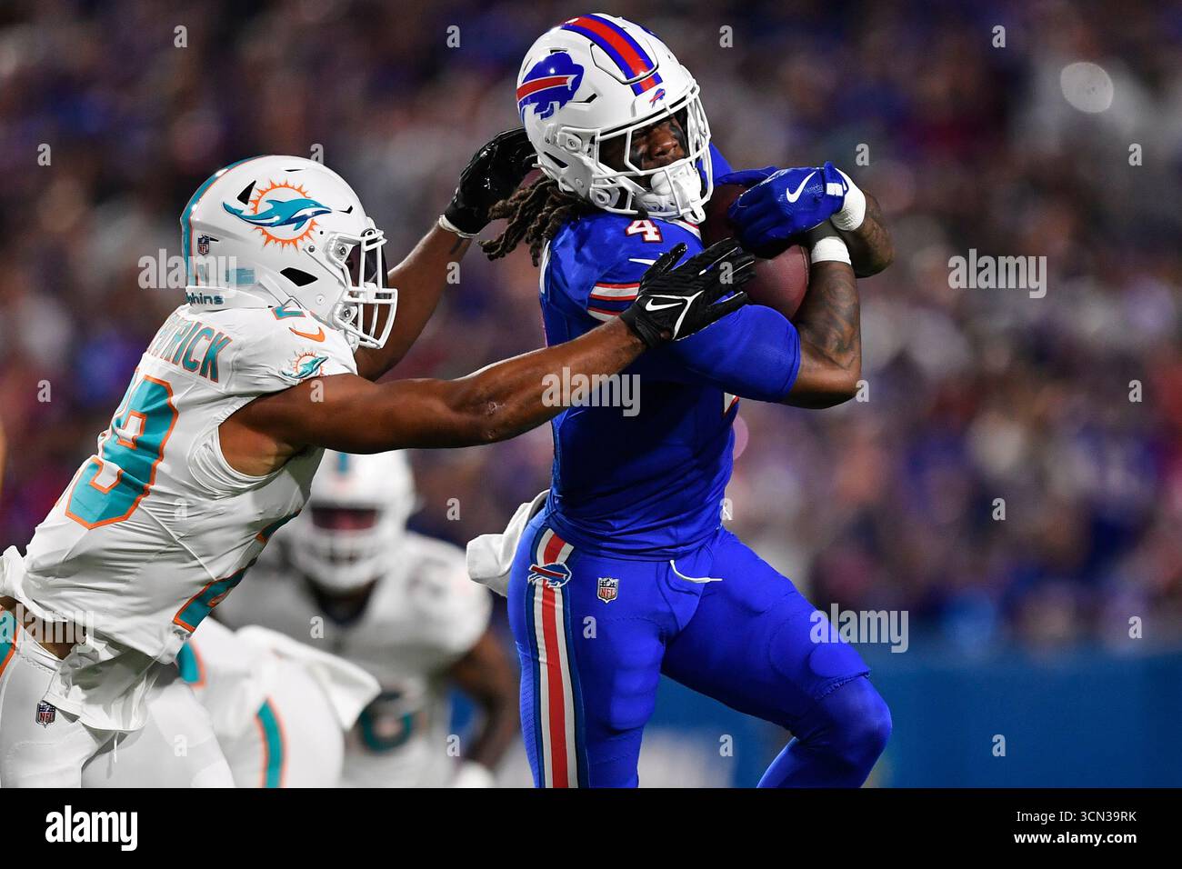 Miami Dolphins free safety Minkah Fitzpatrick, left, tackles Buffalo ...
