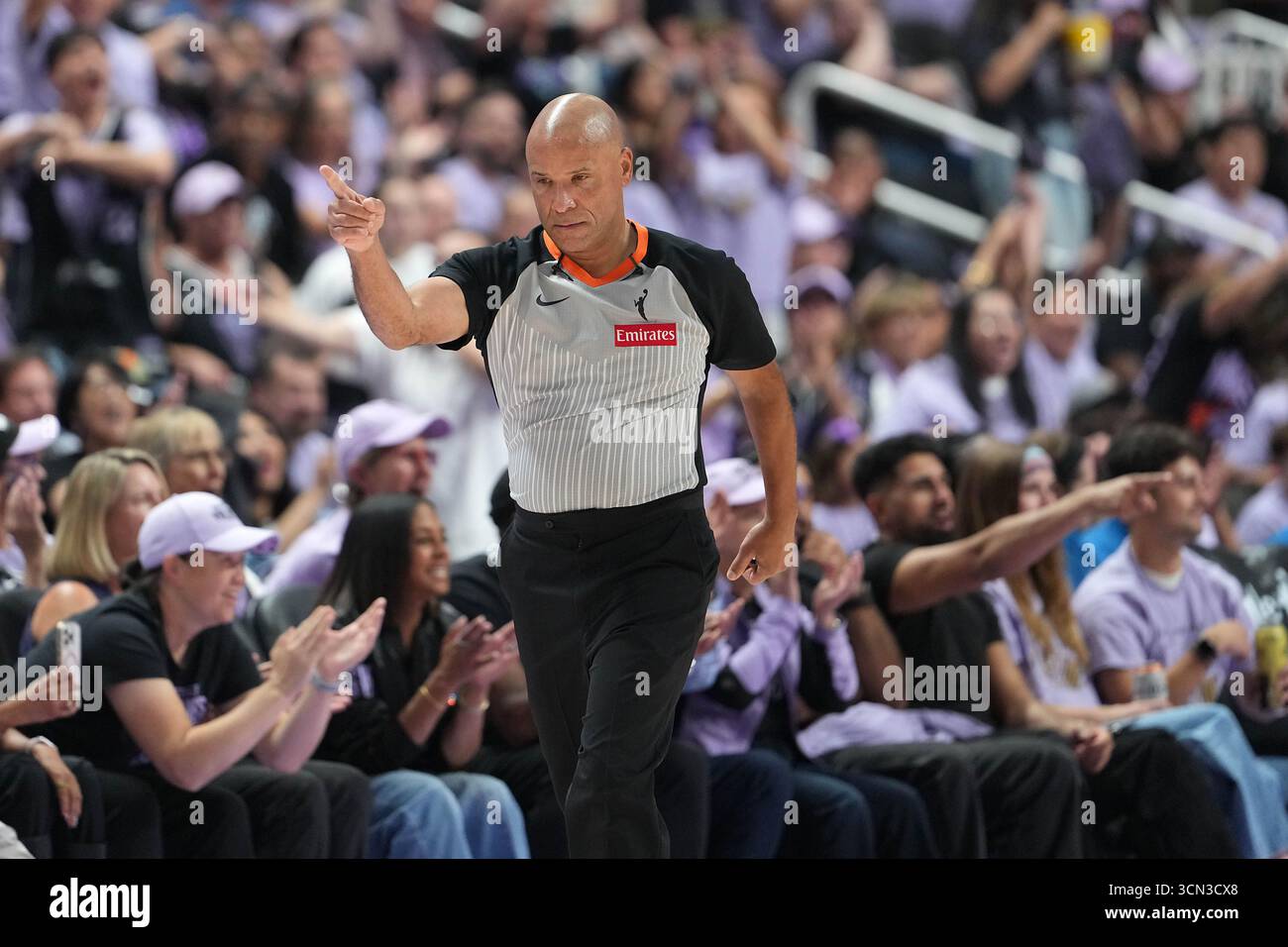Referee Tim Greene #9 makes a call during game two of round one for the ...