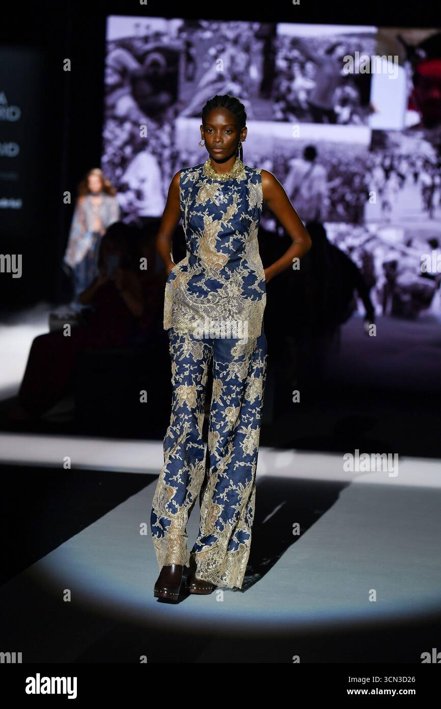 Madrid, Spain. 18th Sep, 2025. A model walks the runway wearing a ...