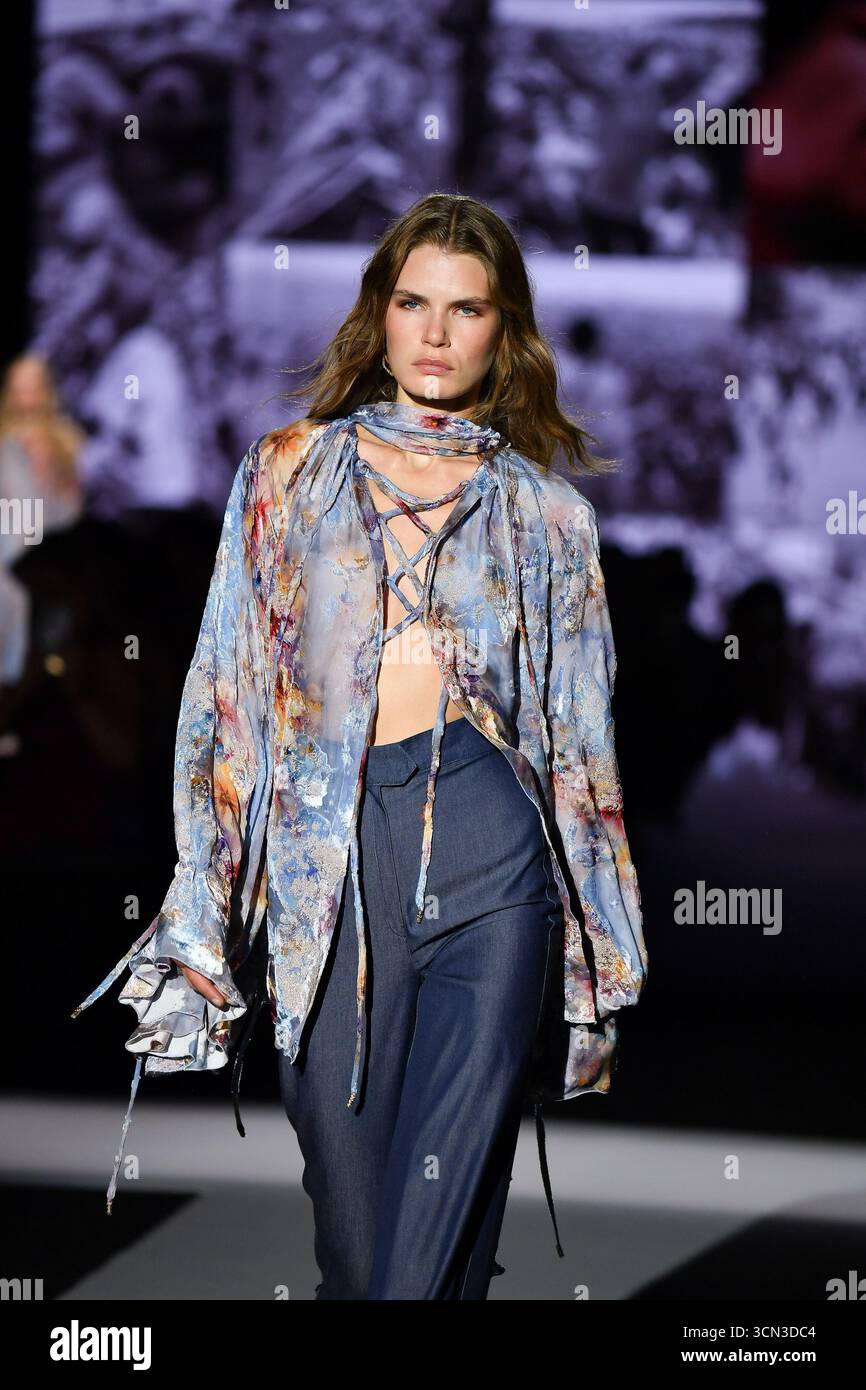 A model walks the runway wearing a design by YOLANCRIS during the ...