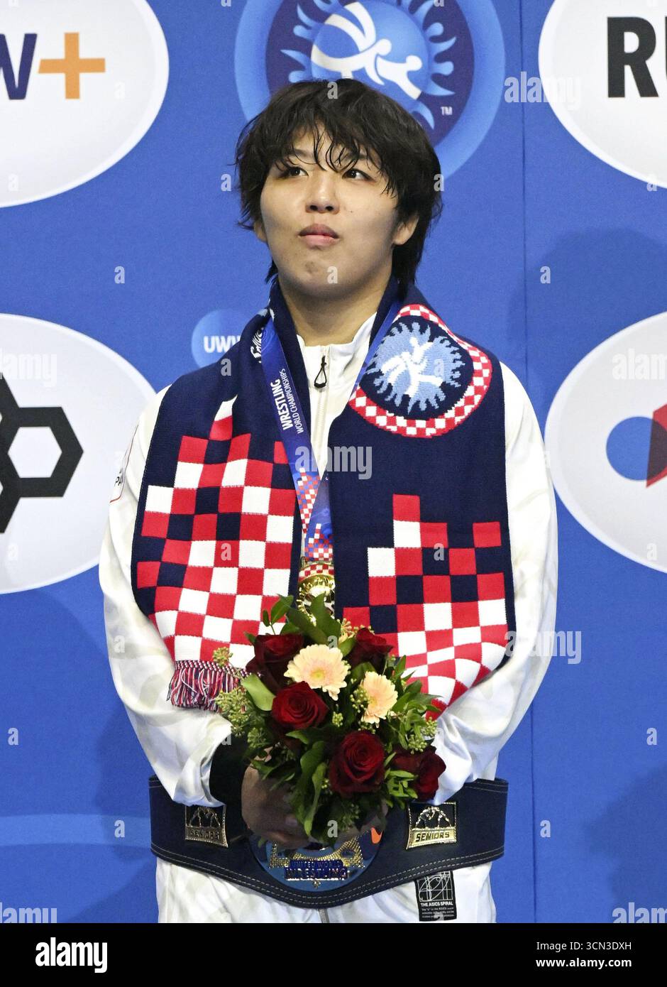 Ami Ishii of Japan poses after defeating Yuliana Vasileva Yaneva of Bulgaria in the women's 68 ...