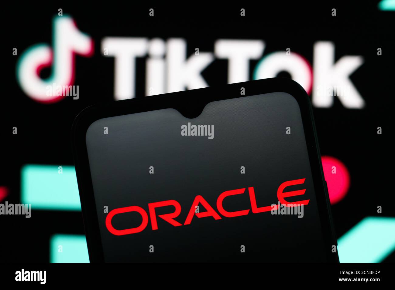In this photo illustration, the Oracle logo is seen displayed on a ...