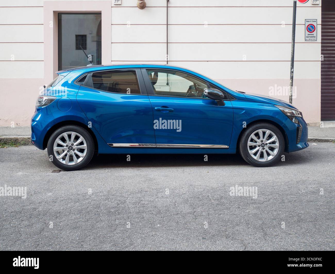 Cremona, Italy September 16th 2025 Blue 2023 Renault Clio V E Tech full hybrid techno car parked ...