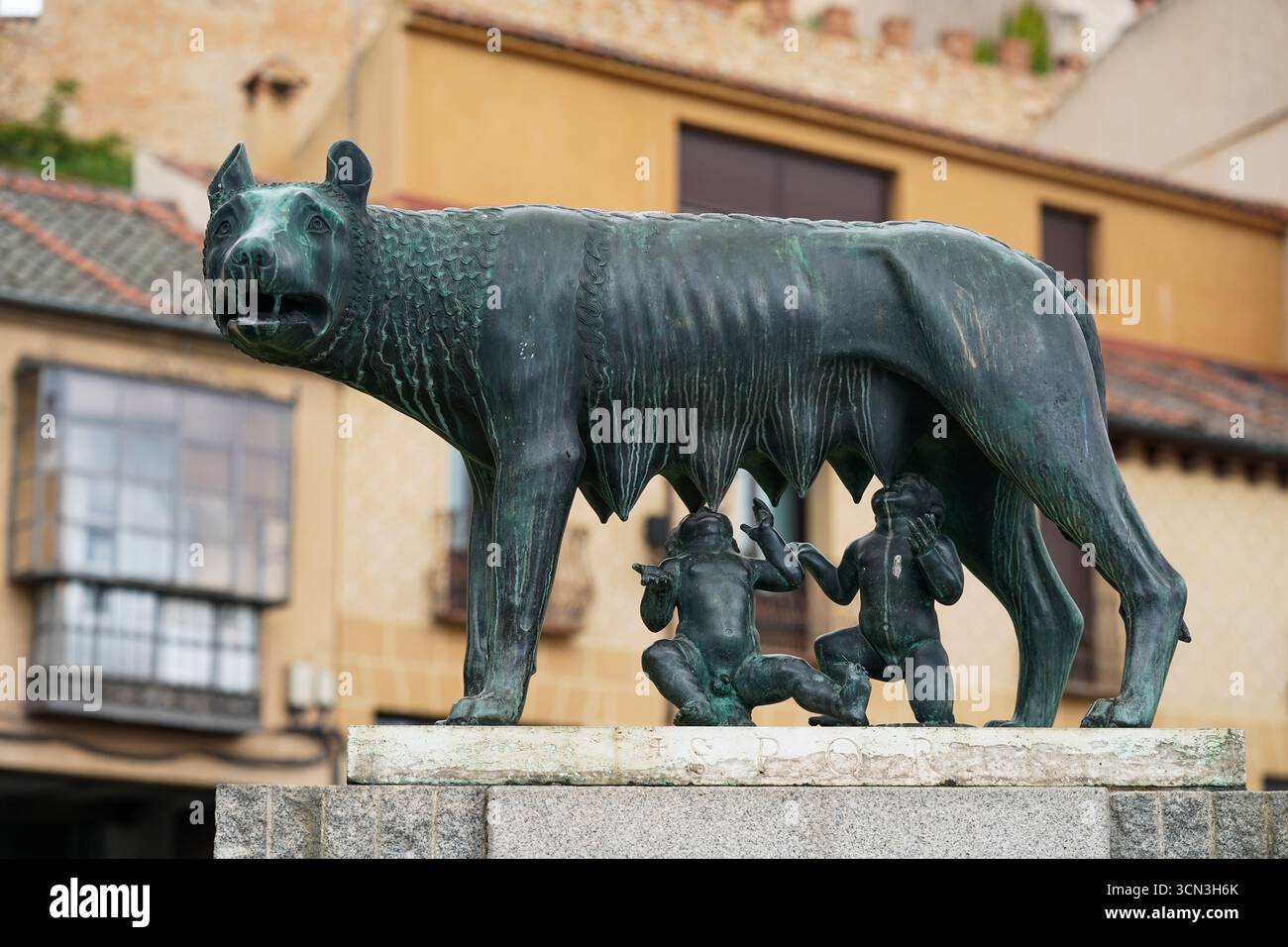 The Capitoline Wolf statue under the Roman aqueduct in Segovia, Spain ...