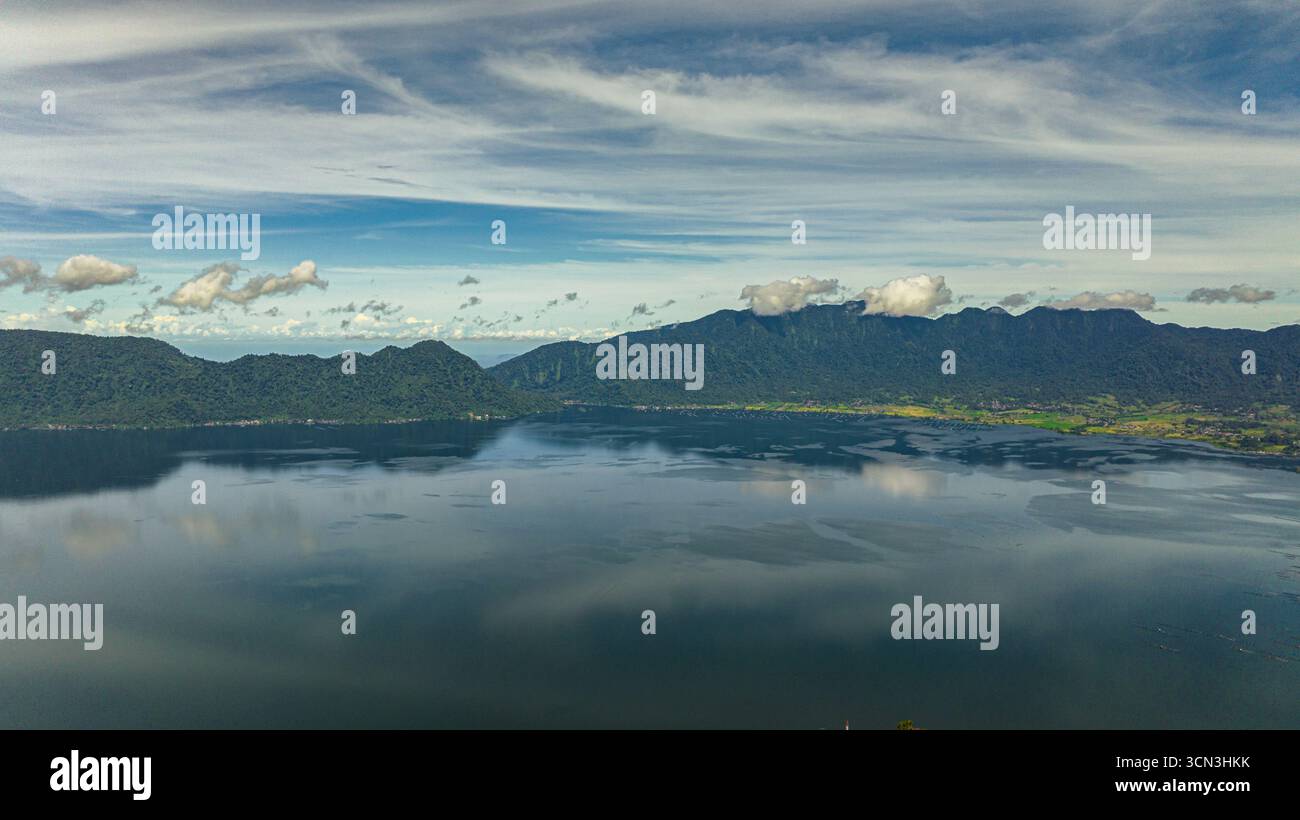 Blue lake Maninjau in a crater among the mountains. Sumatra, Indonesia ...