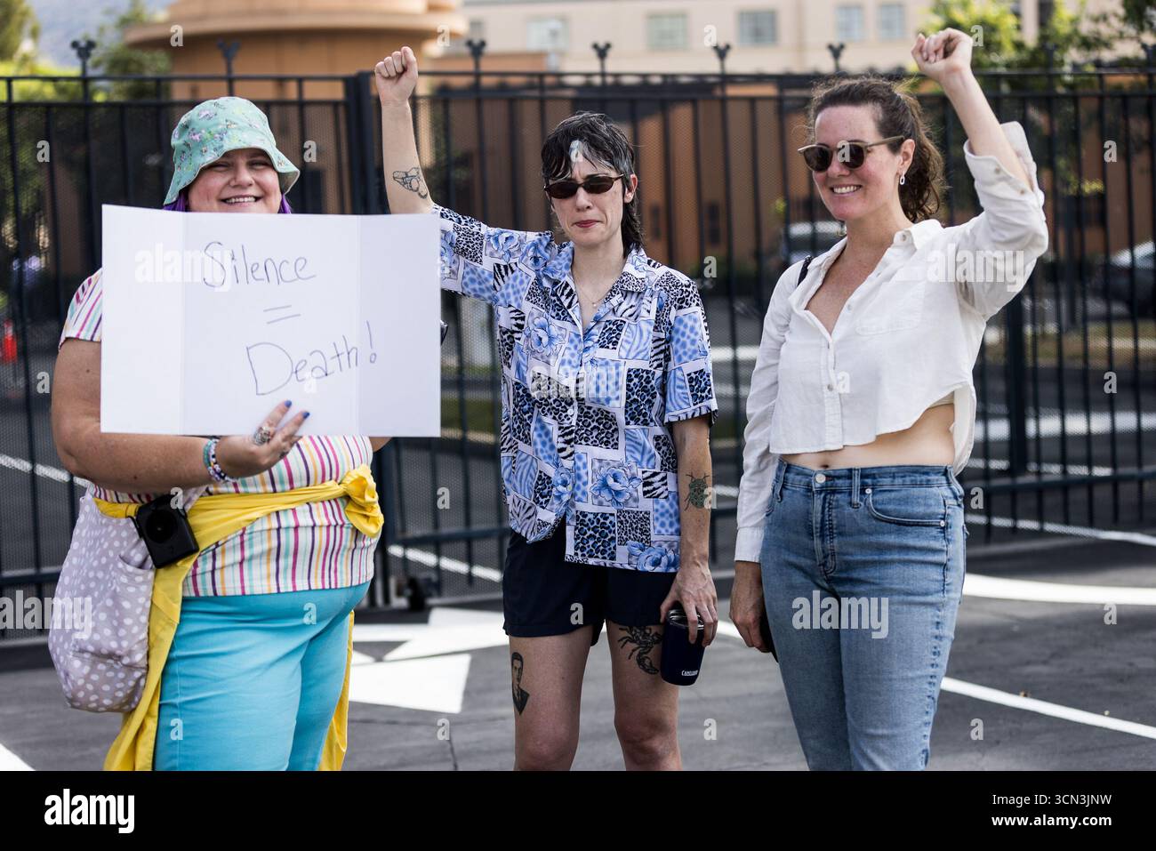 Protesters gather outside the gates of Walt Disney Studios in Burbank ...