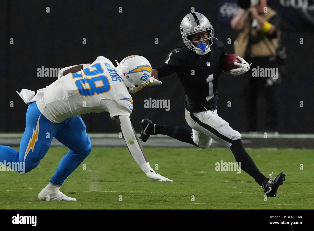Las Vegas Raiders wide receiver Tre Tucker (1) runs the ball against ...
