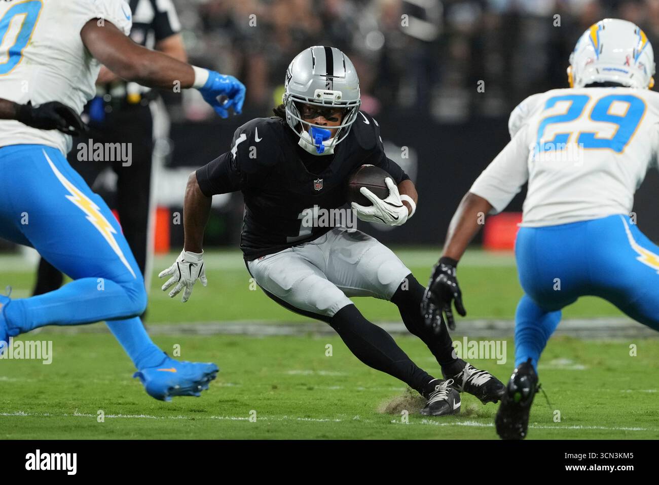 Las Vegas Raiders wide receiver Tre Tucker (1) runs the ball against the Los Angeles Chargers ...
