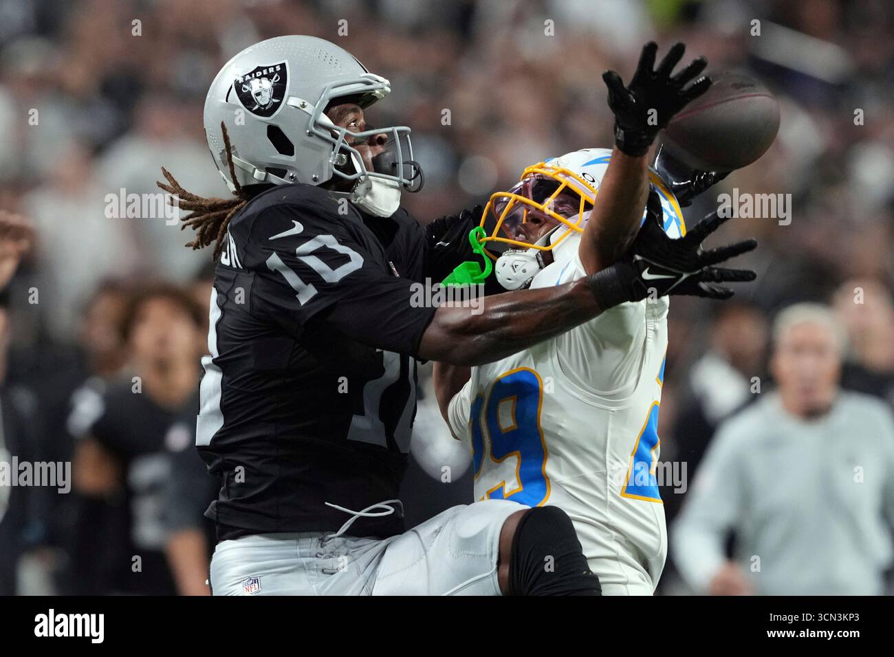 Los Angeles Chargers cornerback Tarheeb Still (29) breaks up a pass intended for Las Vegas ...