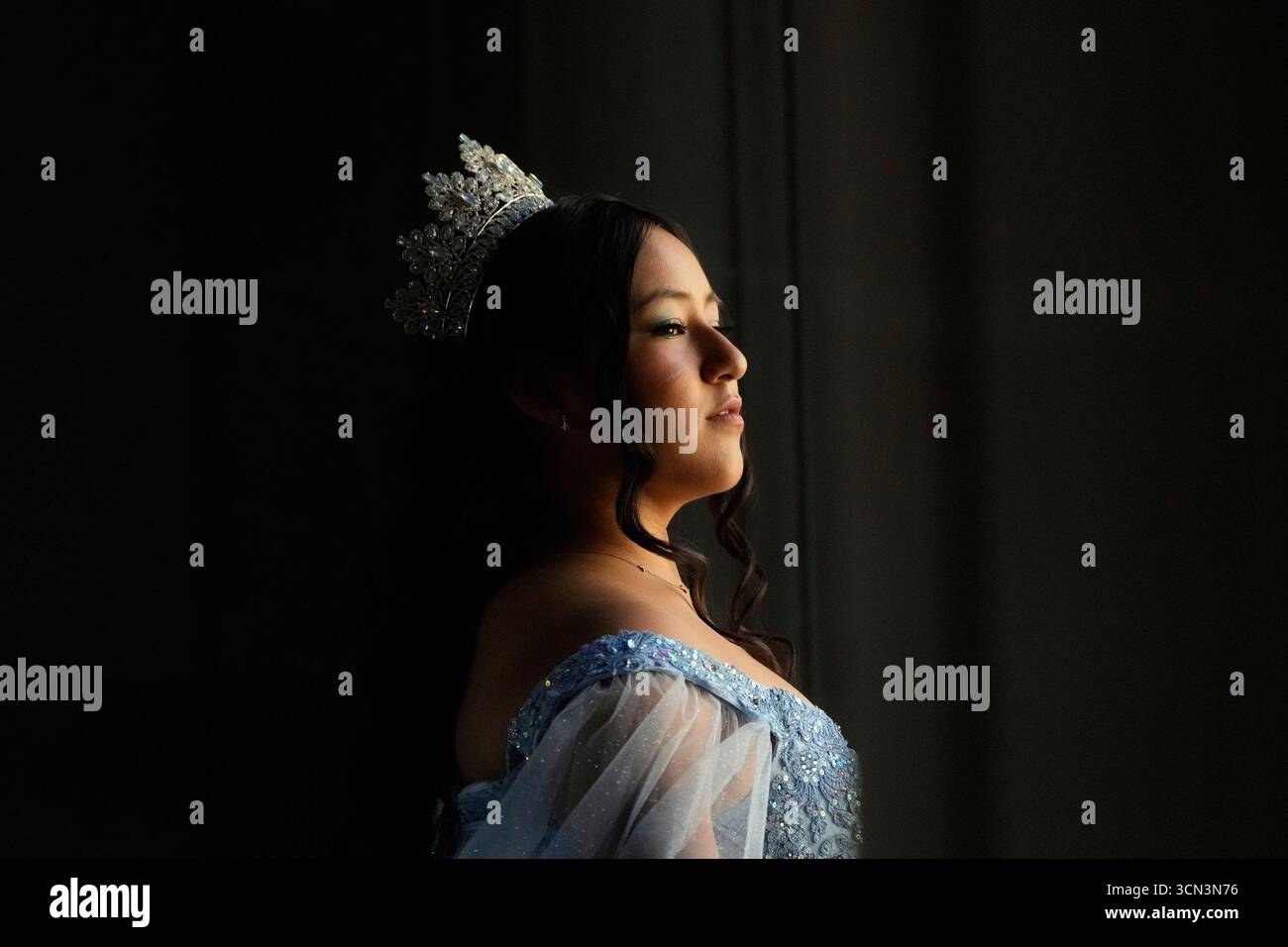 Abbie Gonzalez poses for her quinceañera portrait session at City Hall in San Francisco, Monday ...