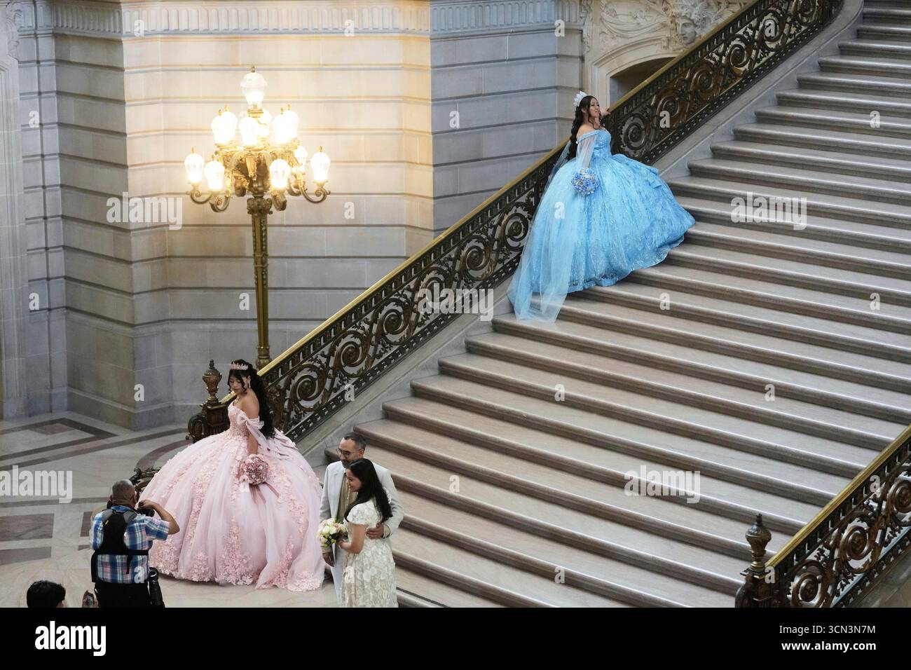 Abbie Gonzalez, top, poses in her quinceañera gown for her professional ...
