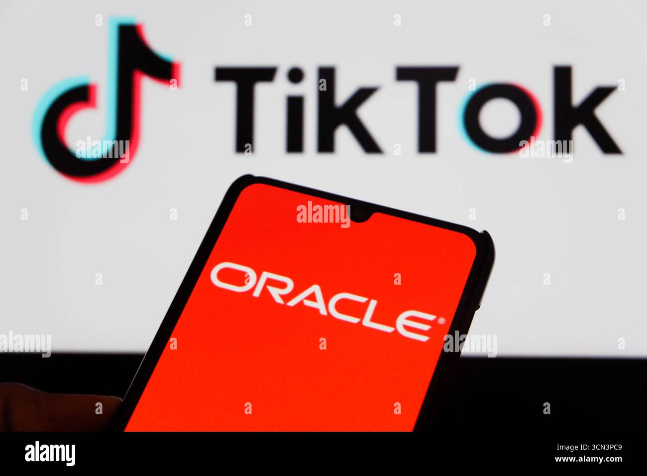 In this photo illustration, an ORACLE logo is displayed on a smartphone ...
