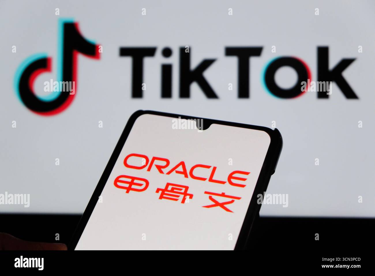 In this photo illustration, an ORACLE logo is displayed on a smartphone ...