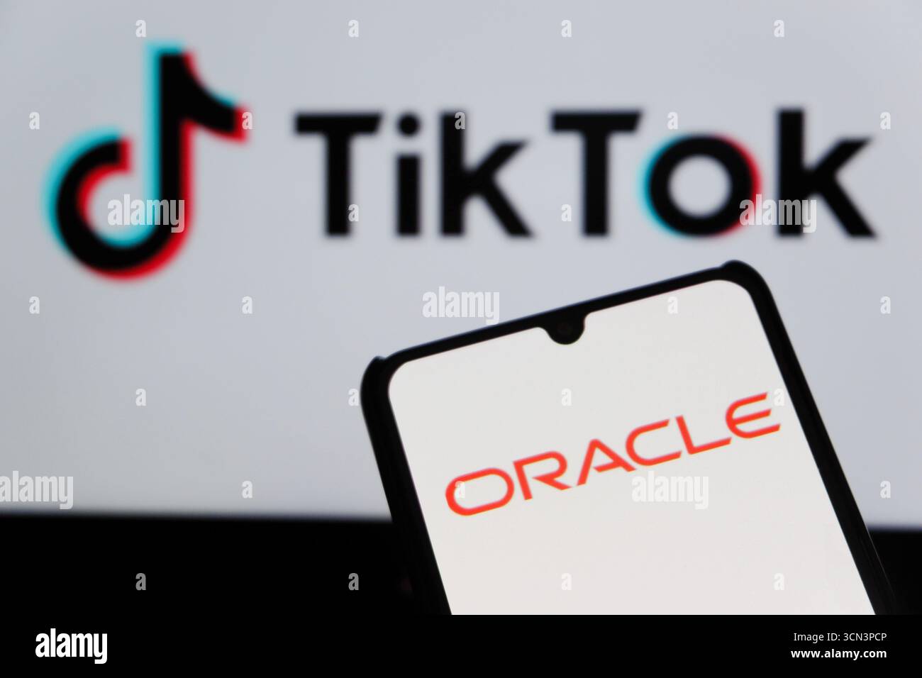 In this photo illustration, an ORACLE logo is displayed on a smartphone ...
