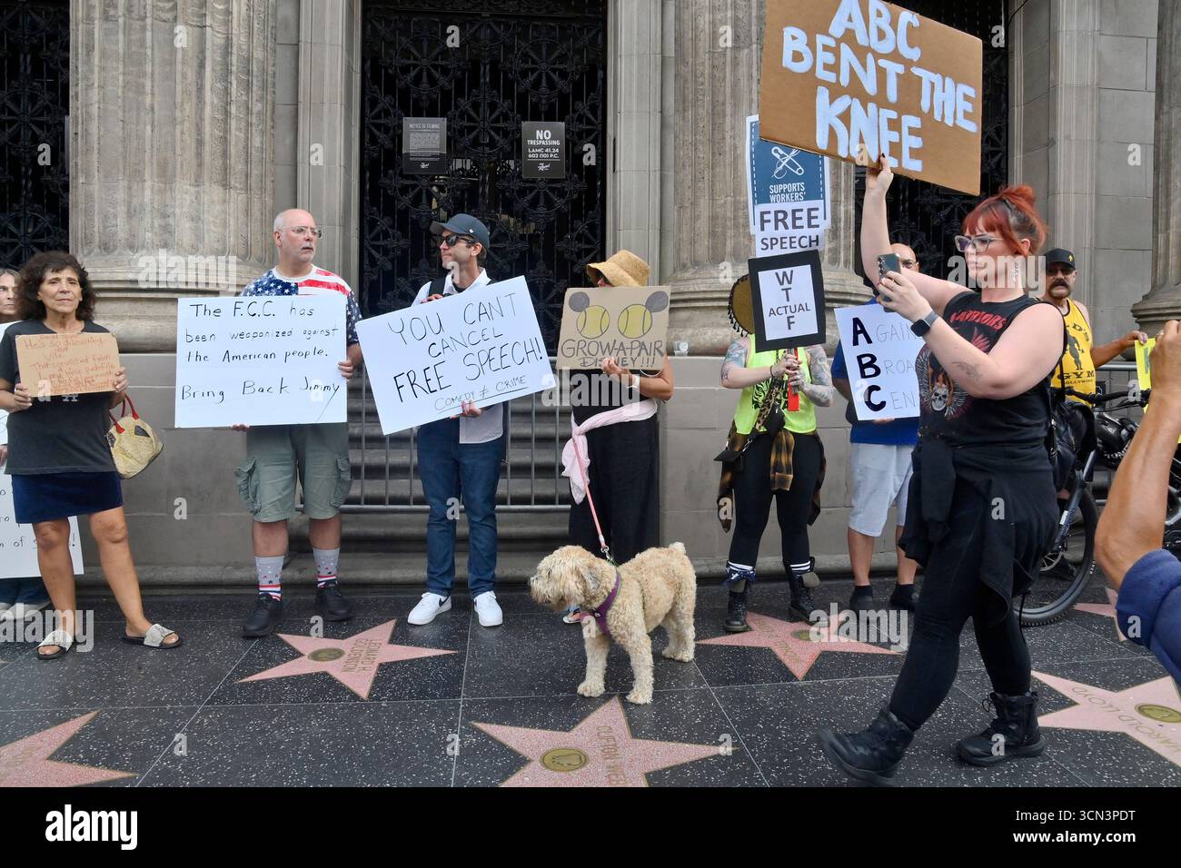 Activists protest outside the El Capitan Entertainment Center on ...