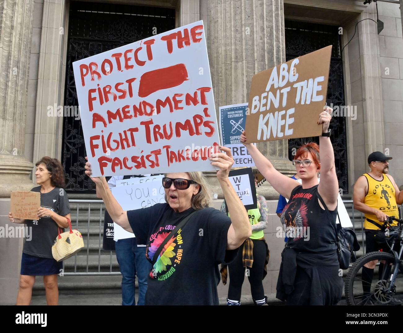 Activists protest outside the El Capitan Entertainment Center on ...