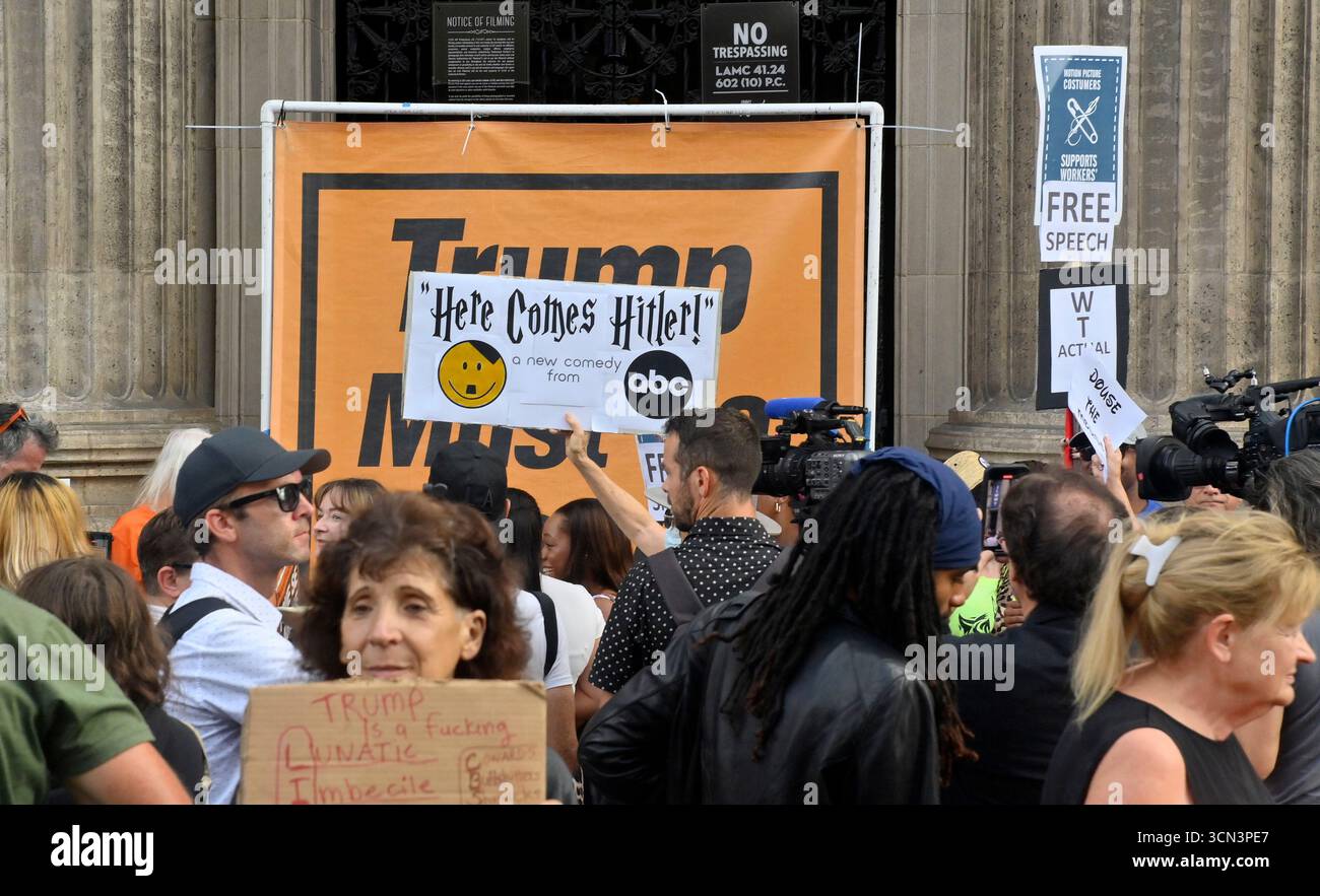 Activists protest outside the El Capitan Entertainment Center on ...