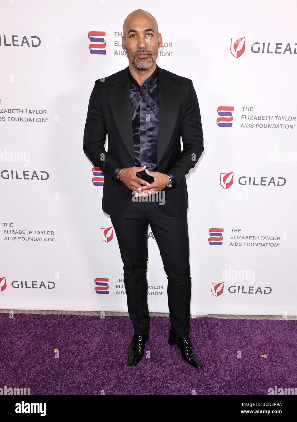 Melvin Robert arrives at The Elizabeth Taylor Night of Compassion held ...
