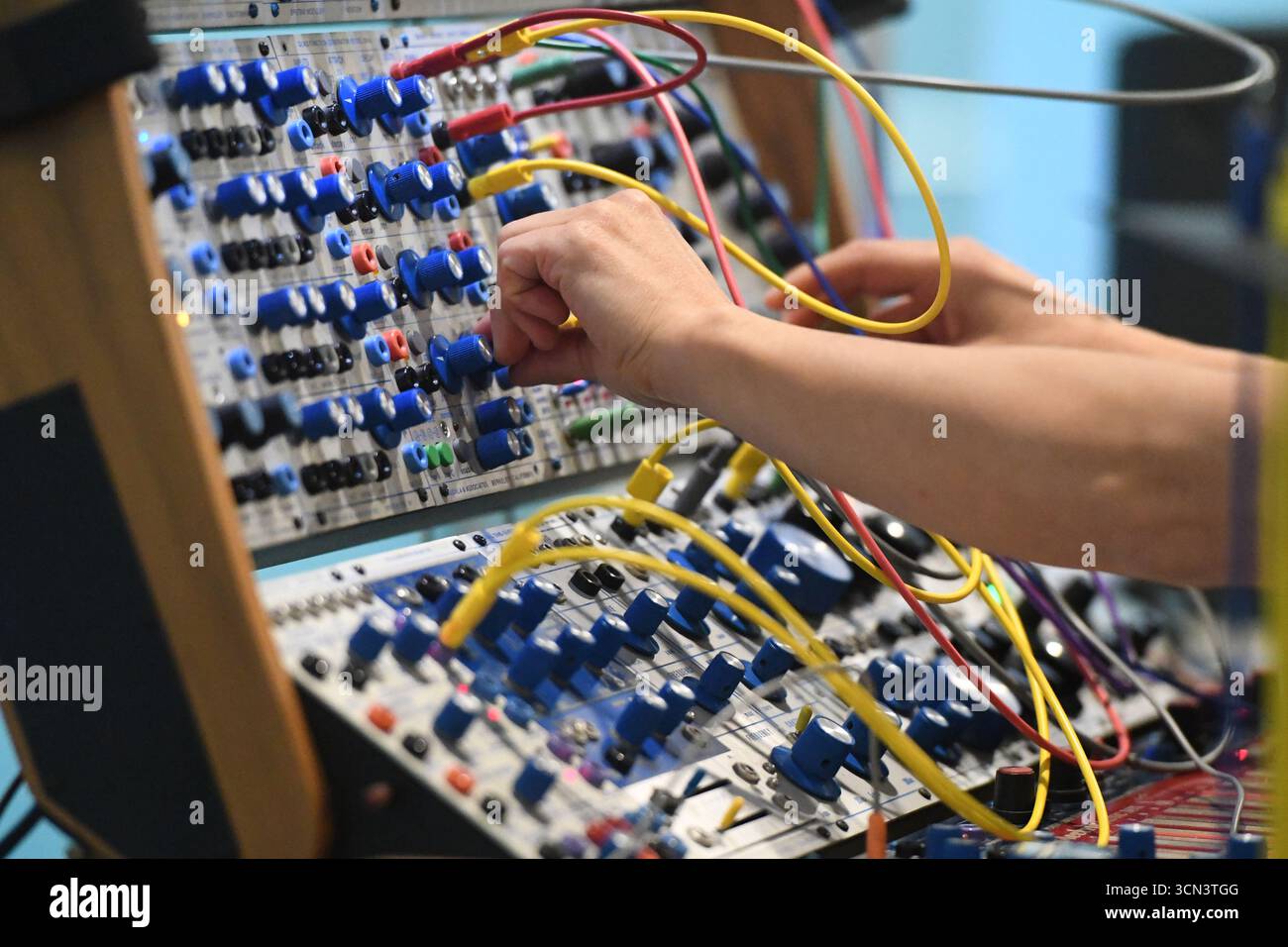 Musicians use synthesisers and audio equipment are seen during the ...