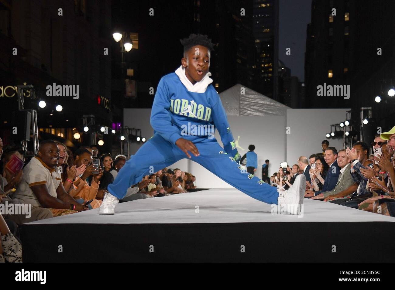 A young model does the splits while walk on the runway during the 'Macy ...