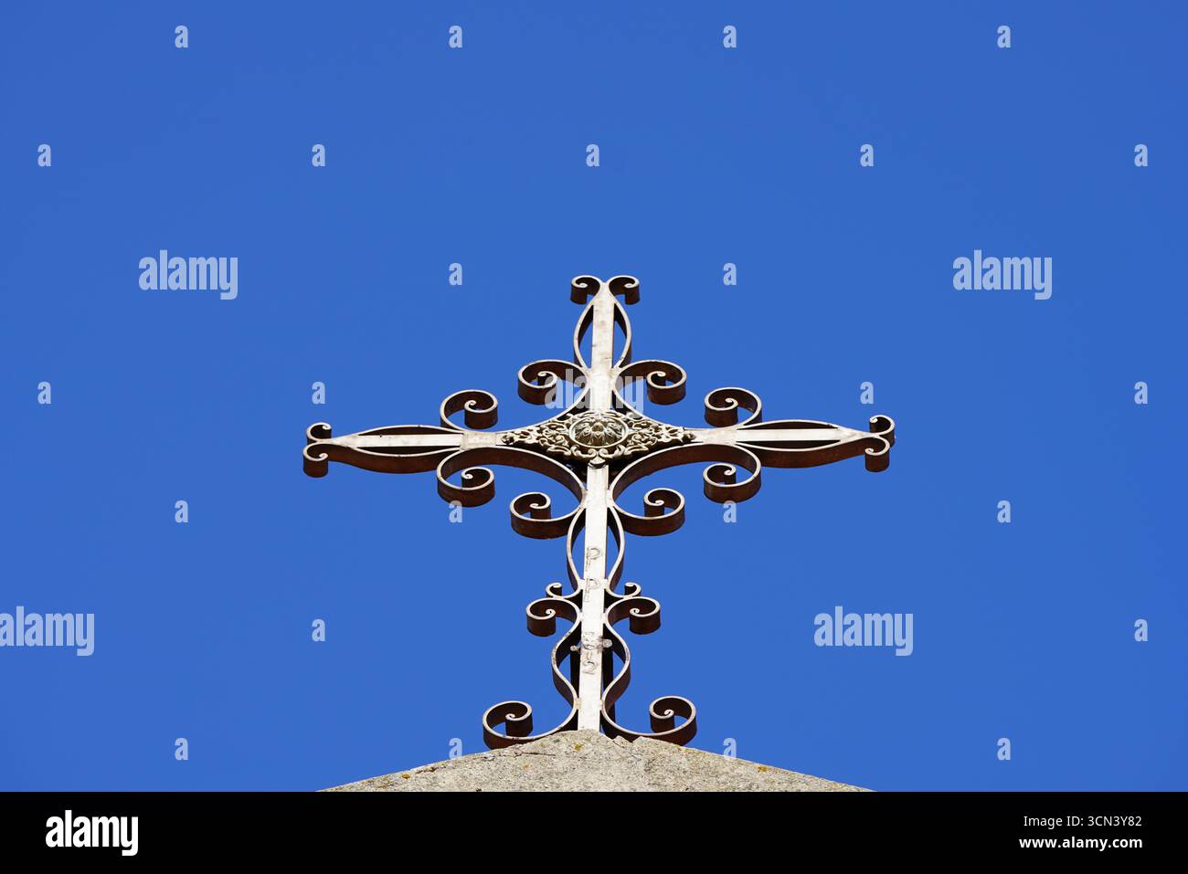 Ornate Metal Cross on Rooftop Against Clear Blue Sky, Symbol of Faith ...