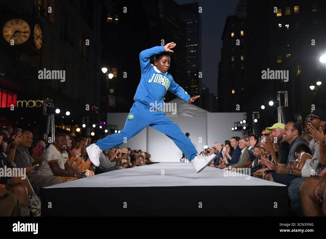 A young model does the splits while walk on the runway during the 'Macy ...