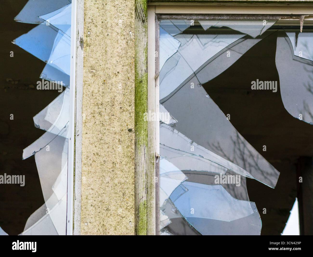 Smashed windows on a house Stock Photo - Alamy