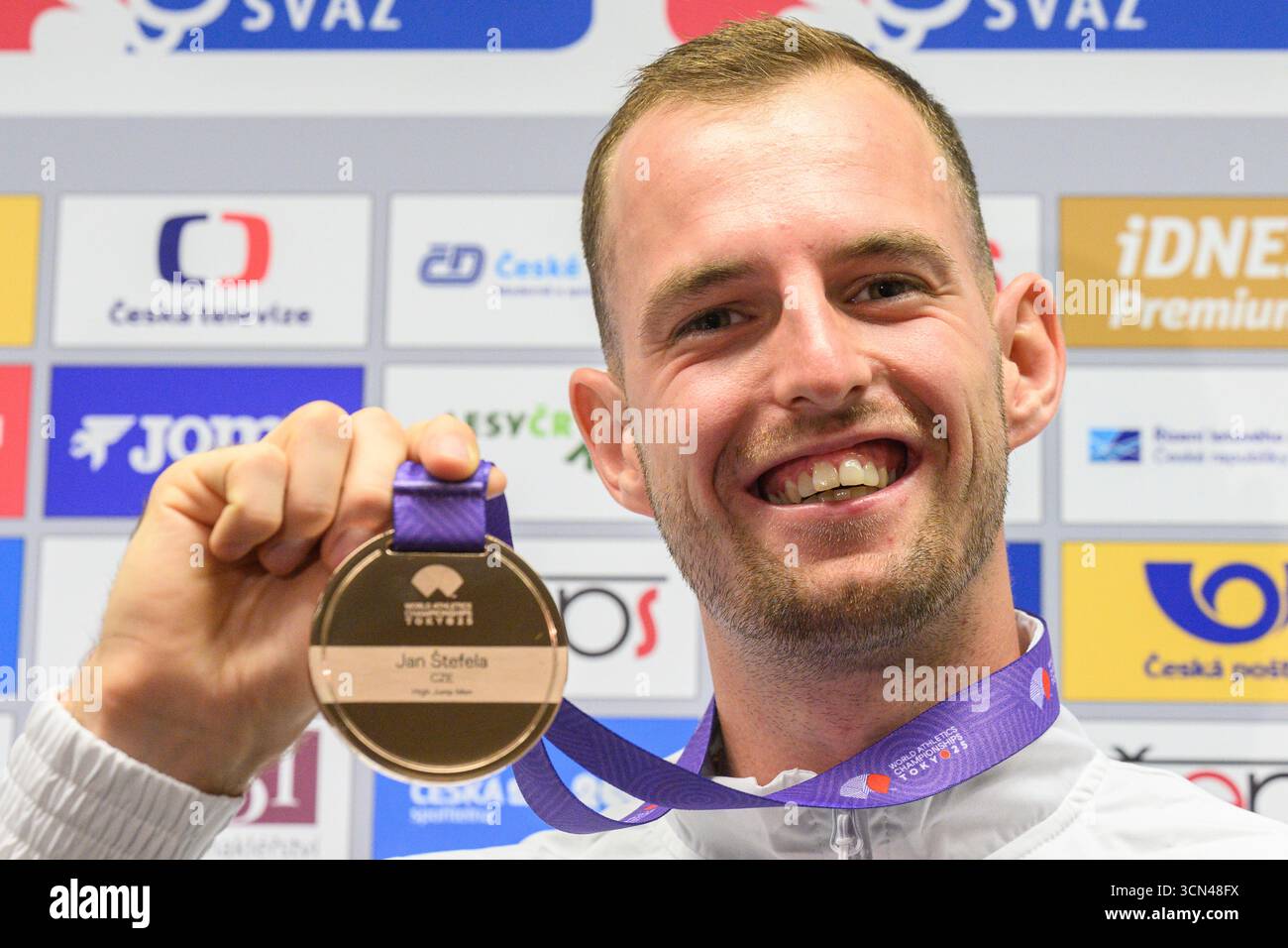 Czech high jumper Jan Stefela shows his bronze medal during a meeting ...