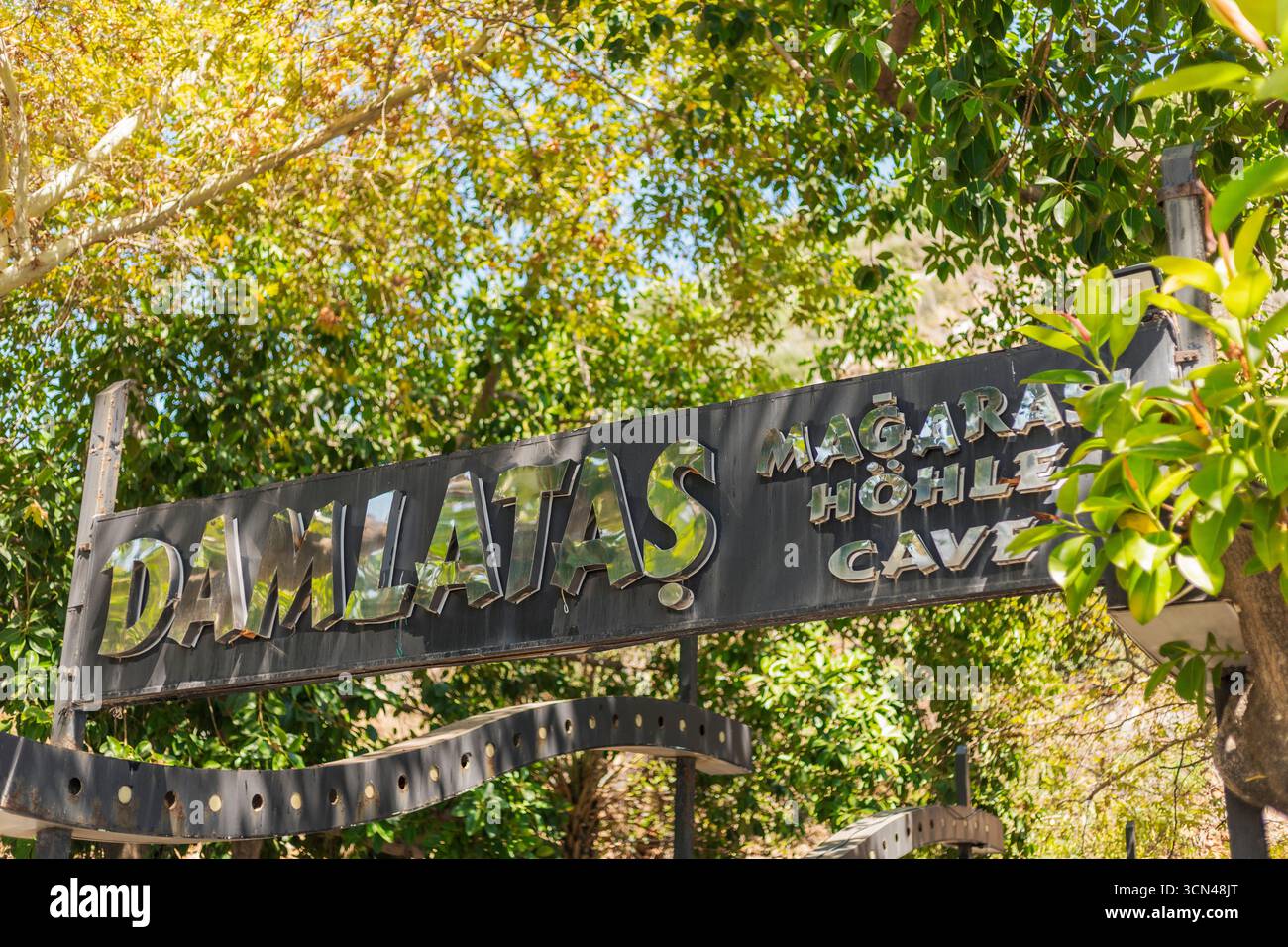Alanya, Turkey - July 10, 2025: The Damlatas Cave sign stands ...
