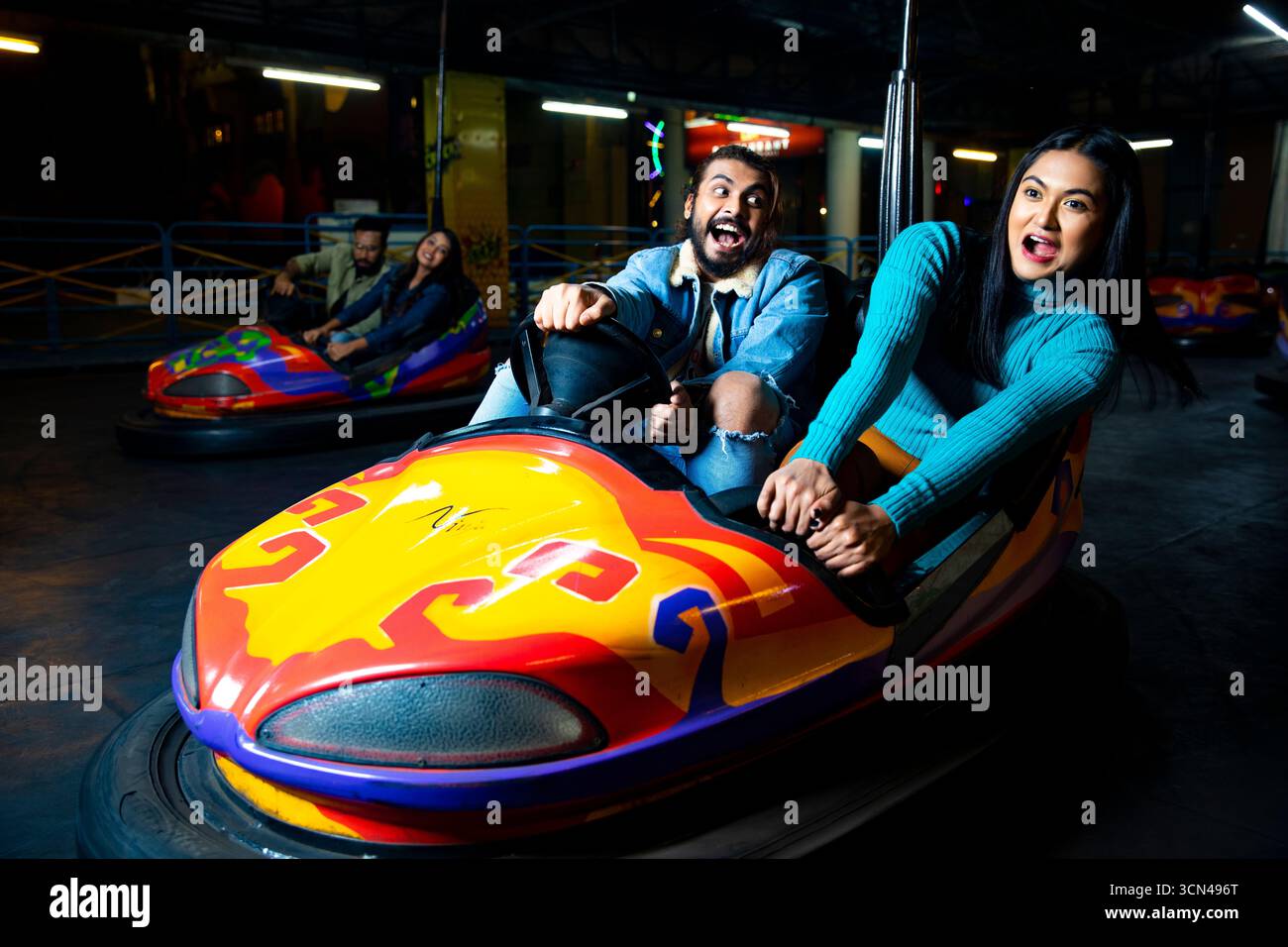 Friends Having Fun on Bumper Cars - Thrilling Amusement Park Ride Stock ...