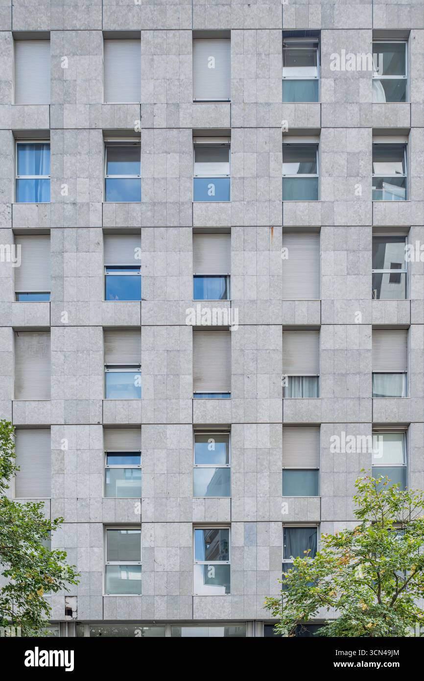 Modern Stone Facade Building With Geometric Window Pattern ...