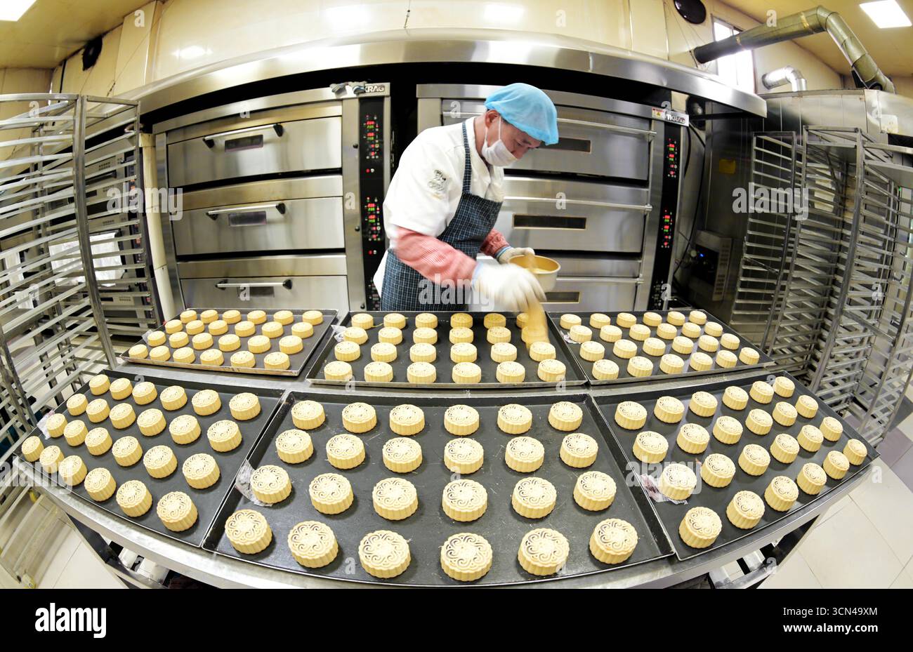 Employees make mooncakes at a food workshop in Haian City, east China's ...