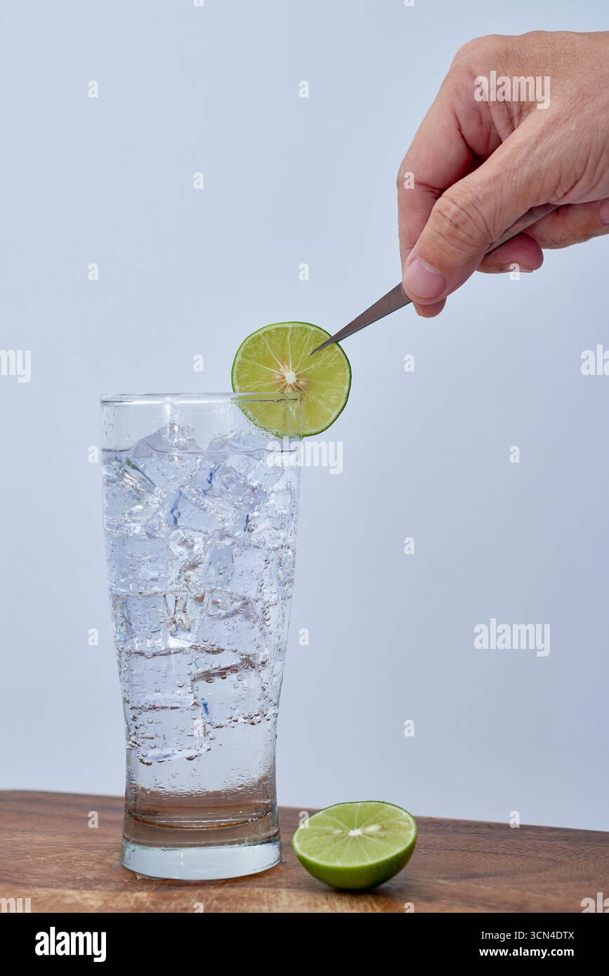 Placing ice in glass preparing hi-res stock photography and images - Alamy