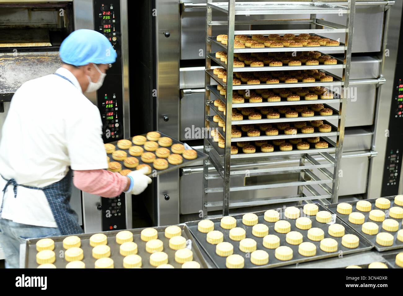 Employees make mooncakes at a food workshop in Haian City, east China's ...