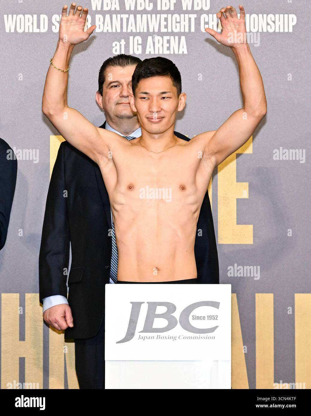 Japan's Ryusei Matsumoto poses on the scale during the official weigh-in for his vacant WBA ...