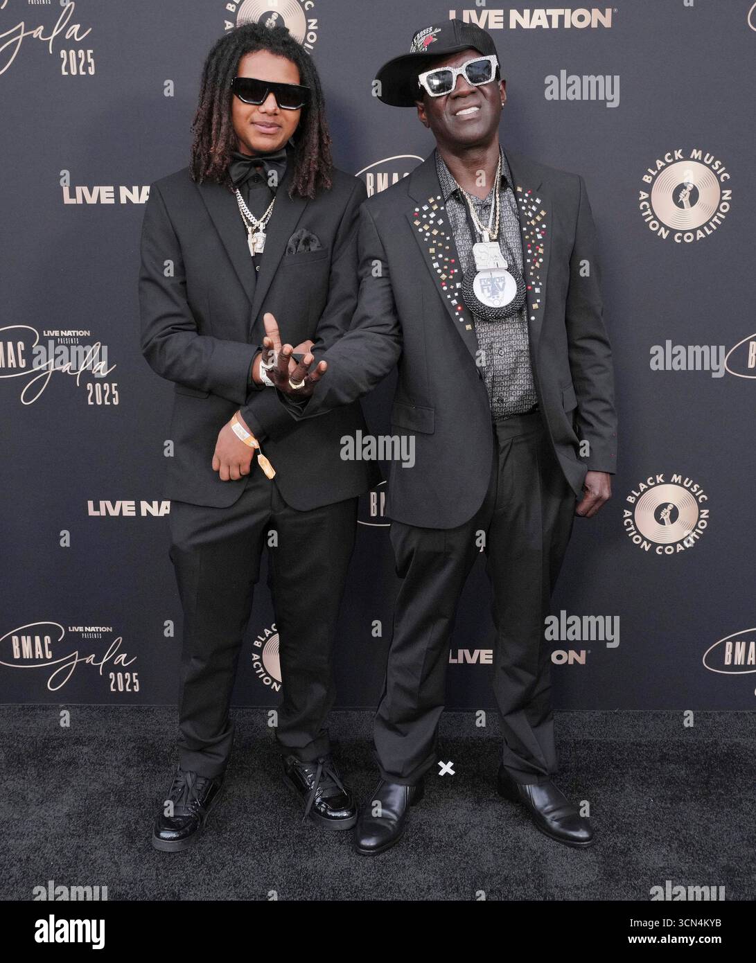 (L-R) Karma Drayton and Flavor Flav at The 5th Annual Black Music Action Coalition Gala held at ...