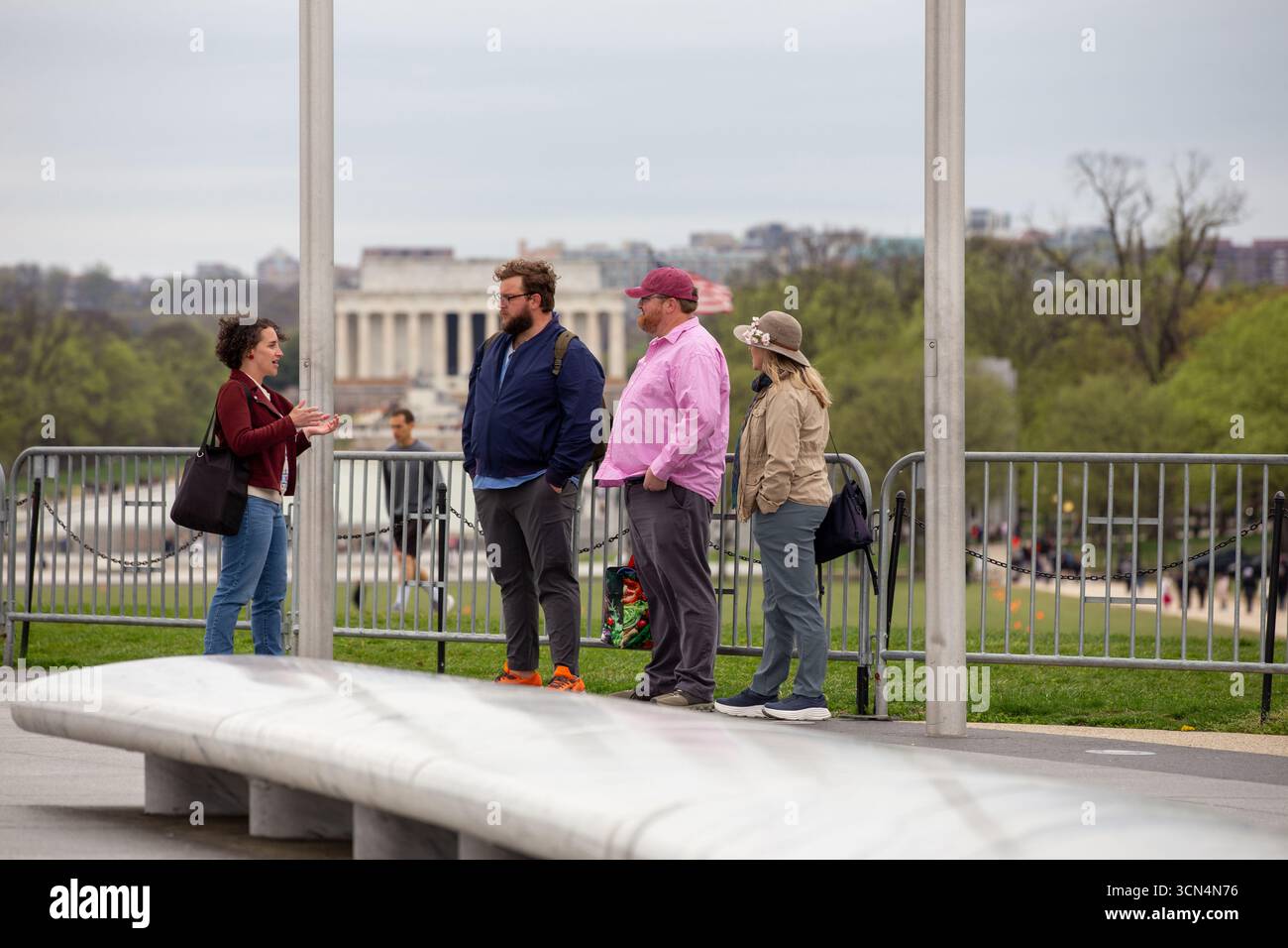 A group of tourists listening to a tour guide in Washington, DC Stock ...
