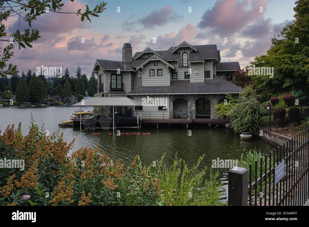 Serene lakeside view residential hi-res stock photography and images ...