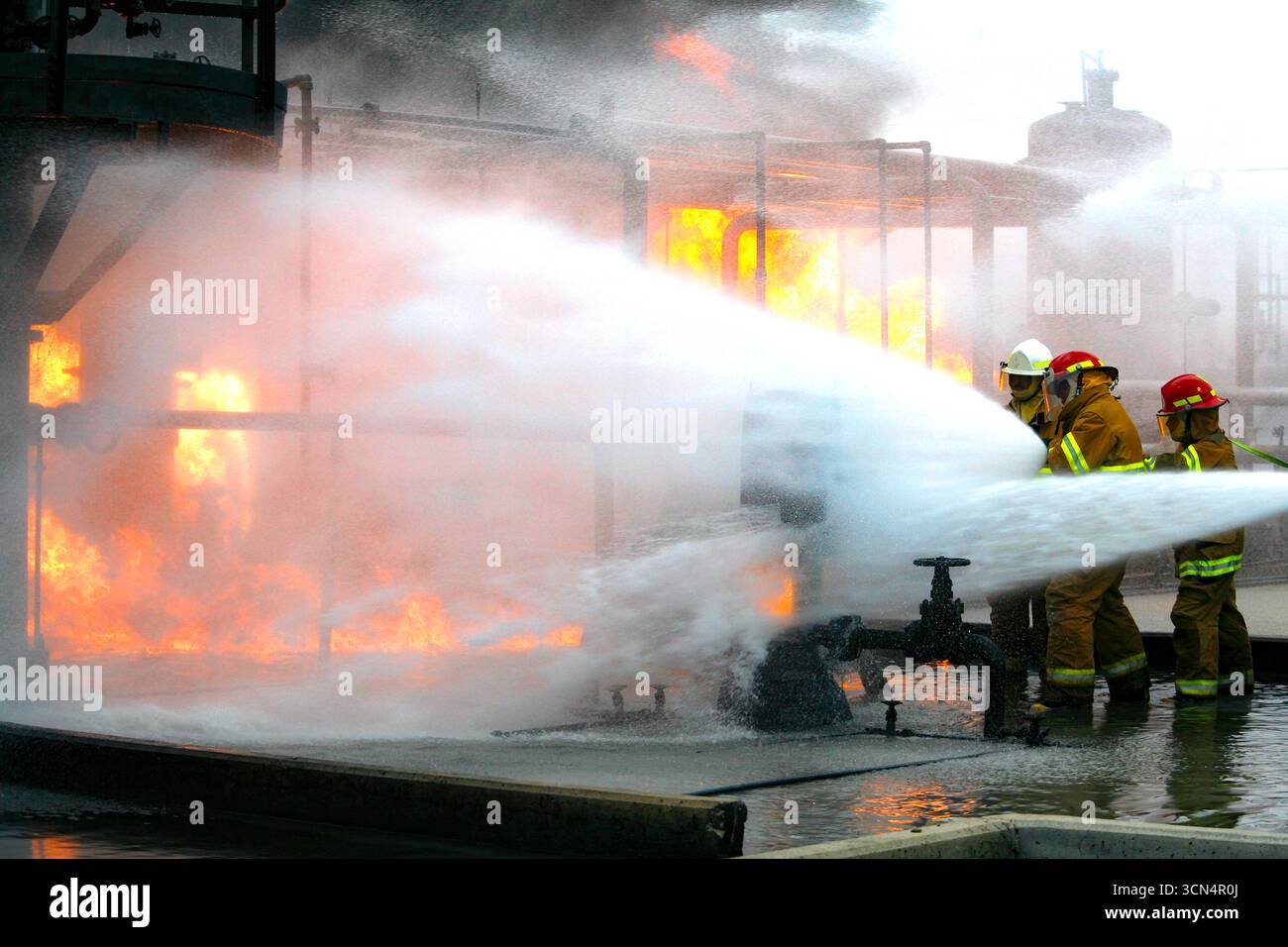 Firefighters practice in a refinery Stock Photo - Alamy