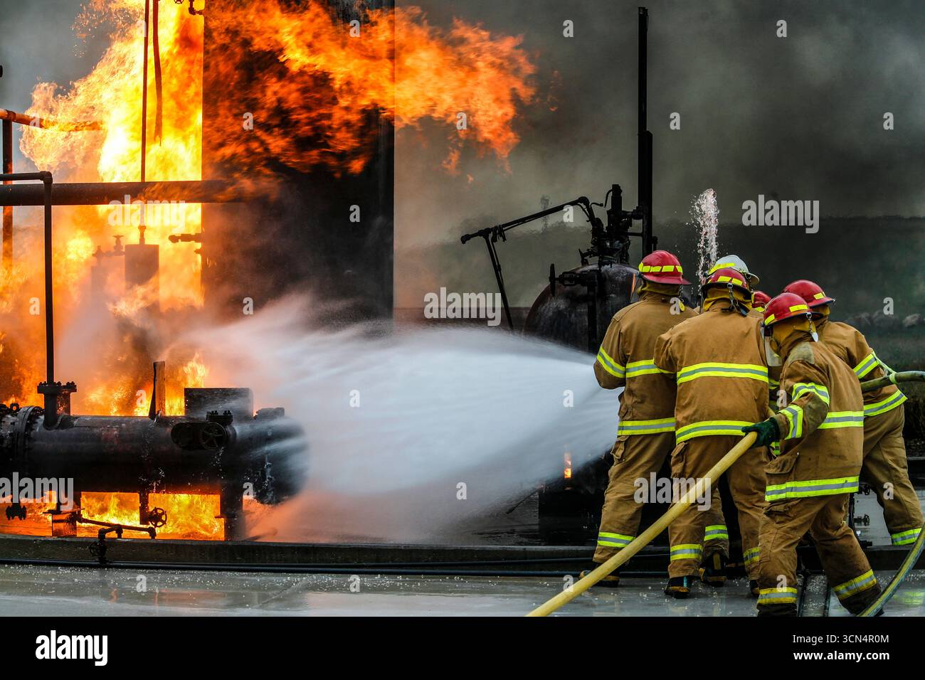 Firefighters practice in a refinery Stock Photo - Alamy