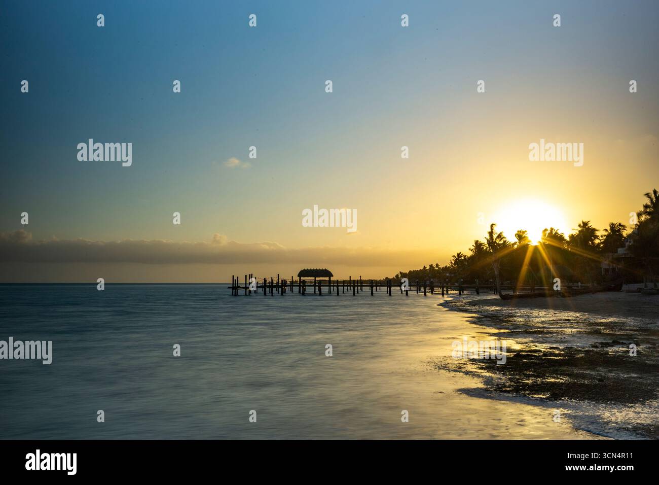 Setting sun over the Florida Keys Stock Photo - Alamy