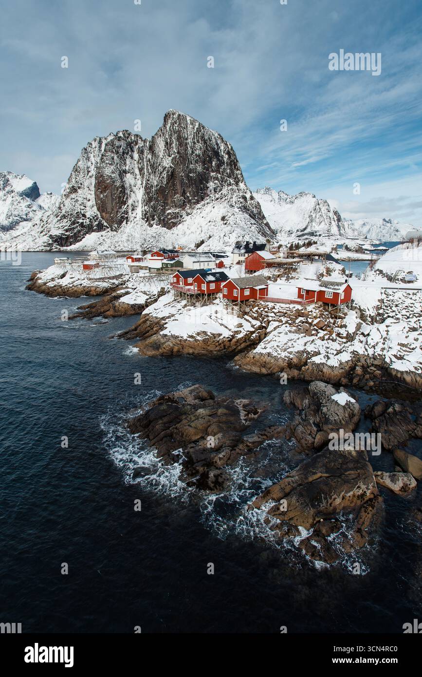 Red Cabins by Snowy Mountains in Norway Stock Photo - Alamy